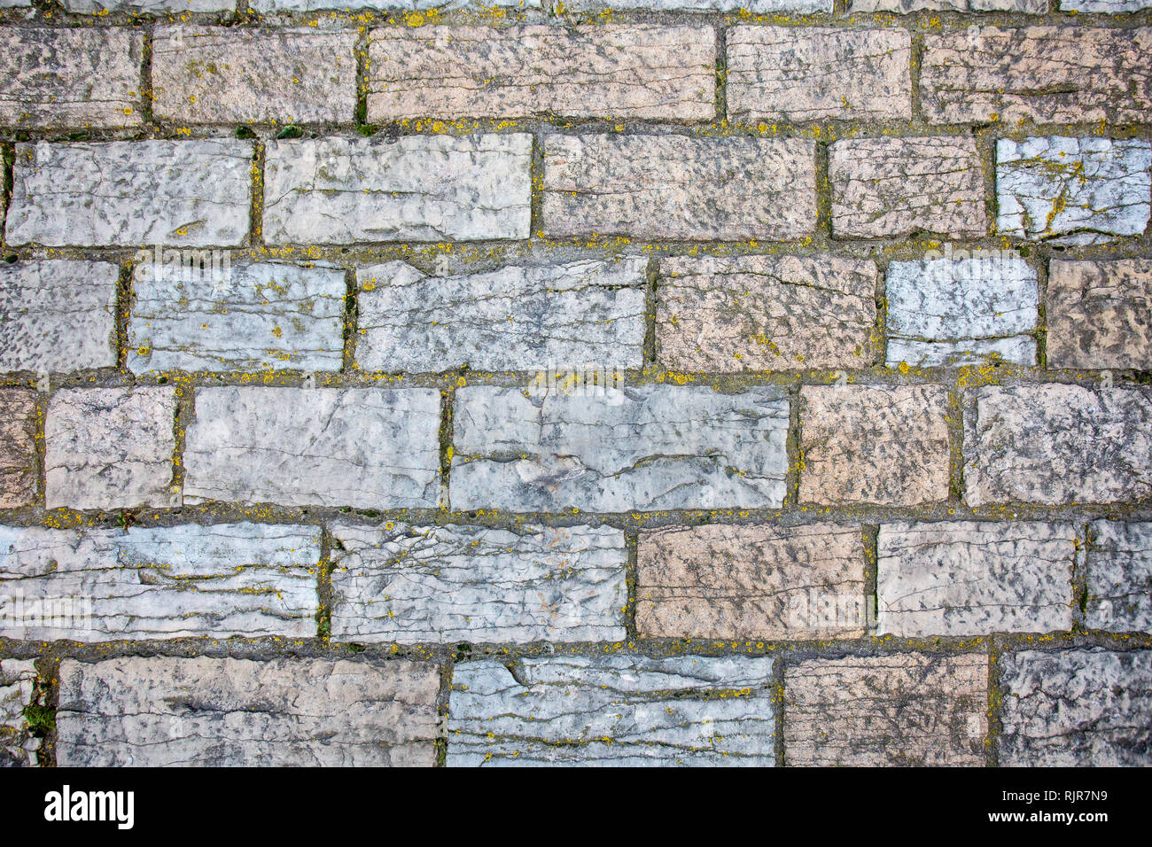 Texture of the old stone wall. Wall of the seafront in Lyon, France ...