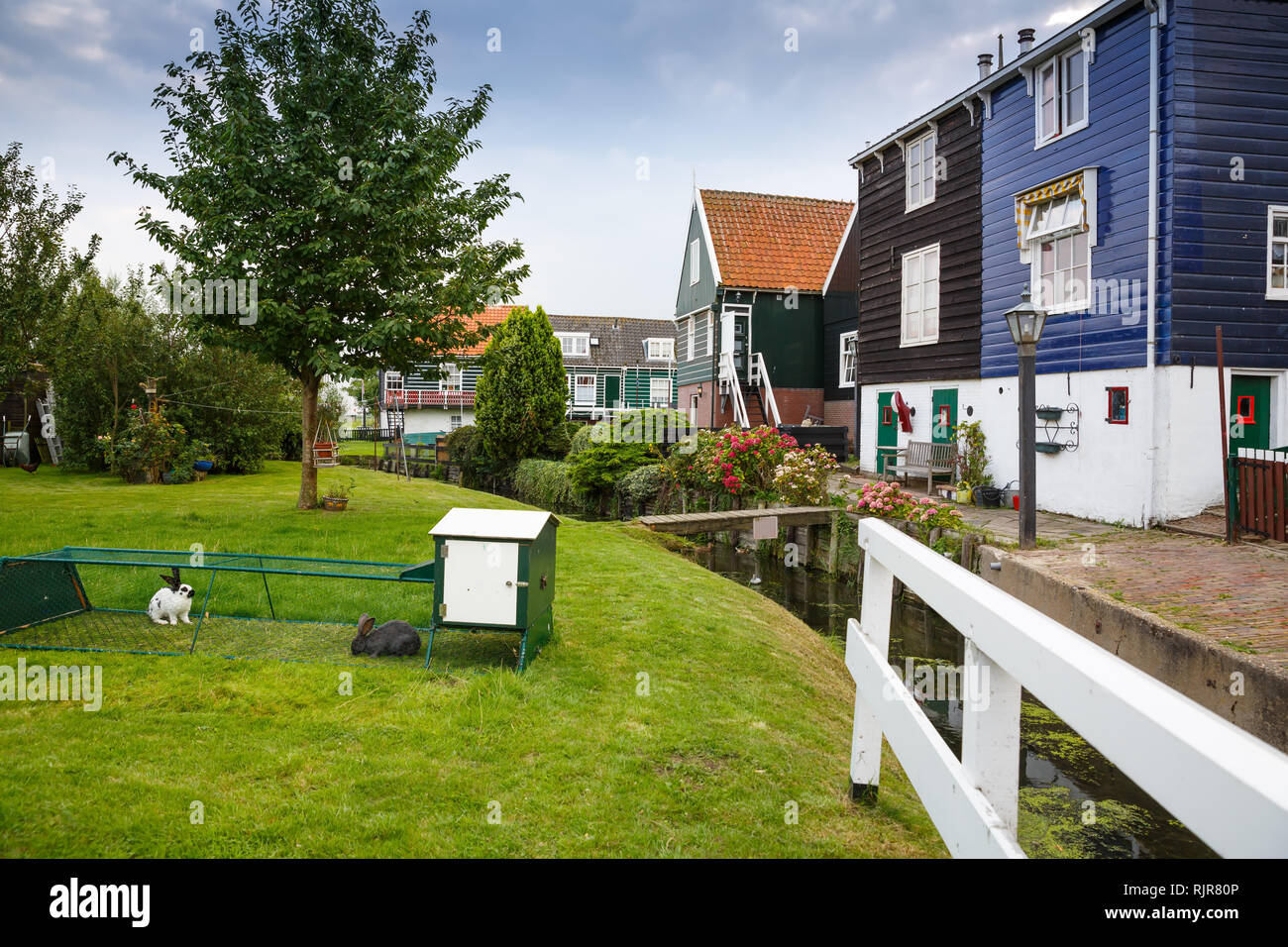 The old traditional colorful houses at the canal in the Dutch fisherman ...