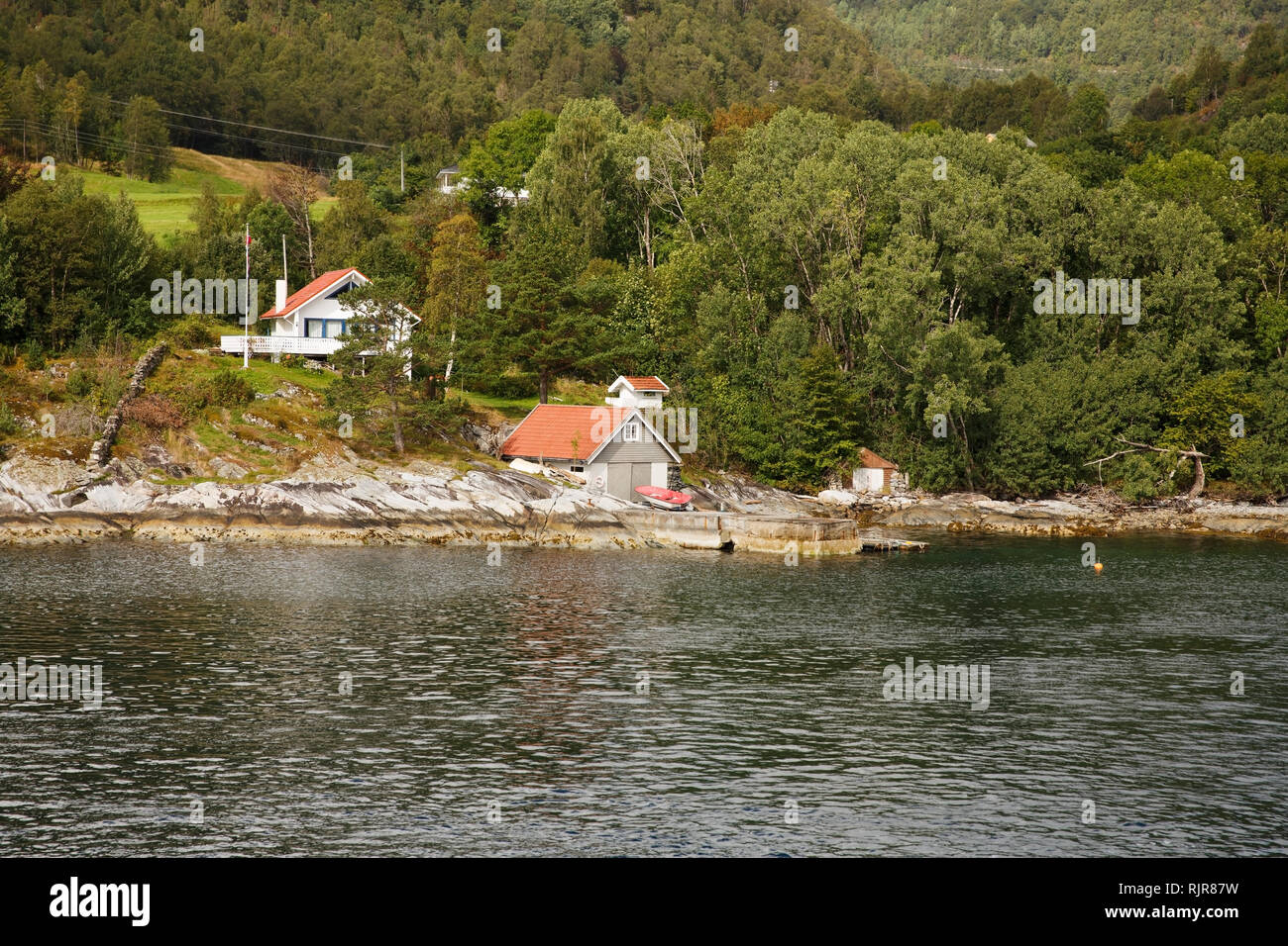 Landscape with mountains, fjord and village in Norway Stock Photo - Alamy
