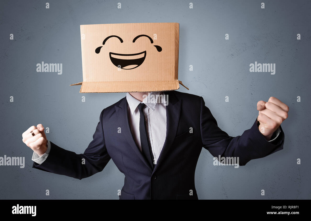 Funny man wearing cardboard box on his head with smiley face Stock ...