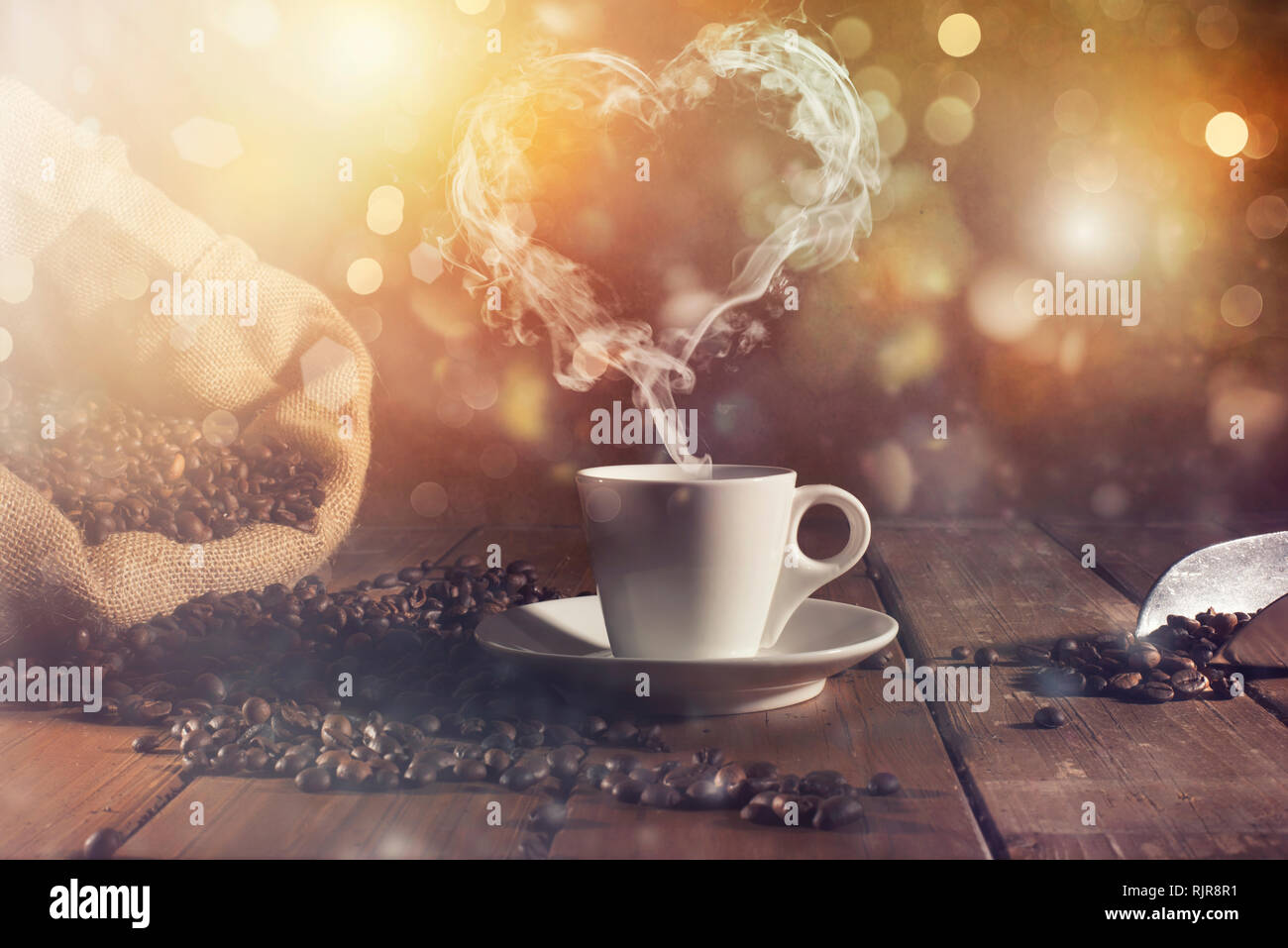 Coffee cup with a smoke shaped as an hearth Stock Photo - Alamy