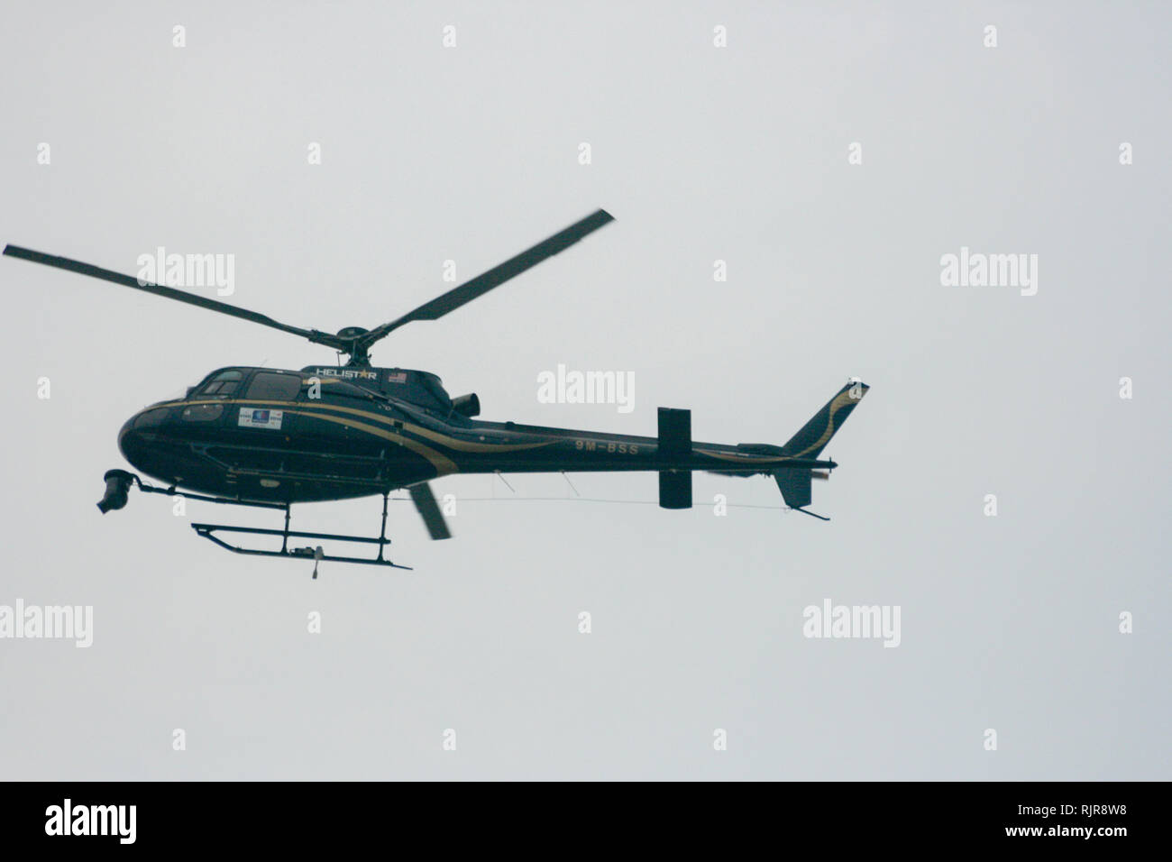 A helicopter hovering over the Formula One (F1) at Sepang Circuit ...