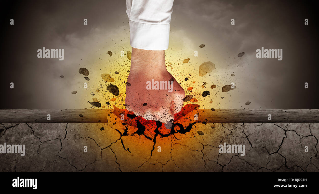 Big hand hits intense and breaks a crass stonewall Stock Photo - Alamy