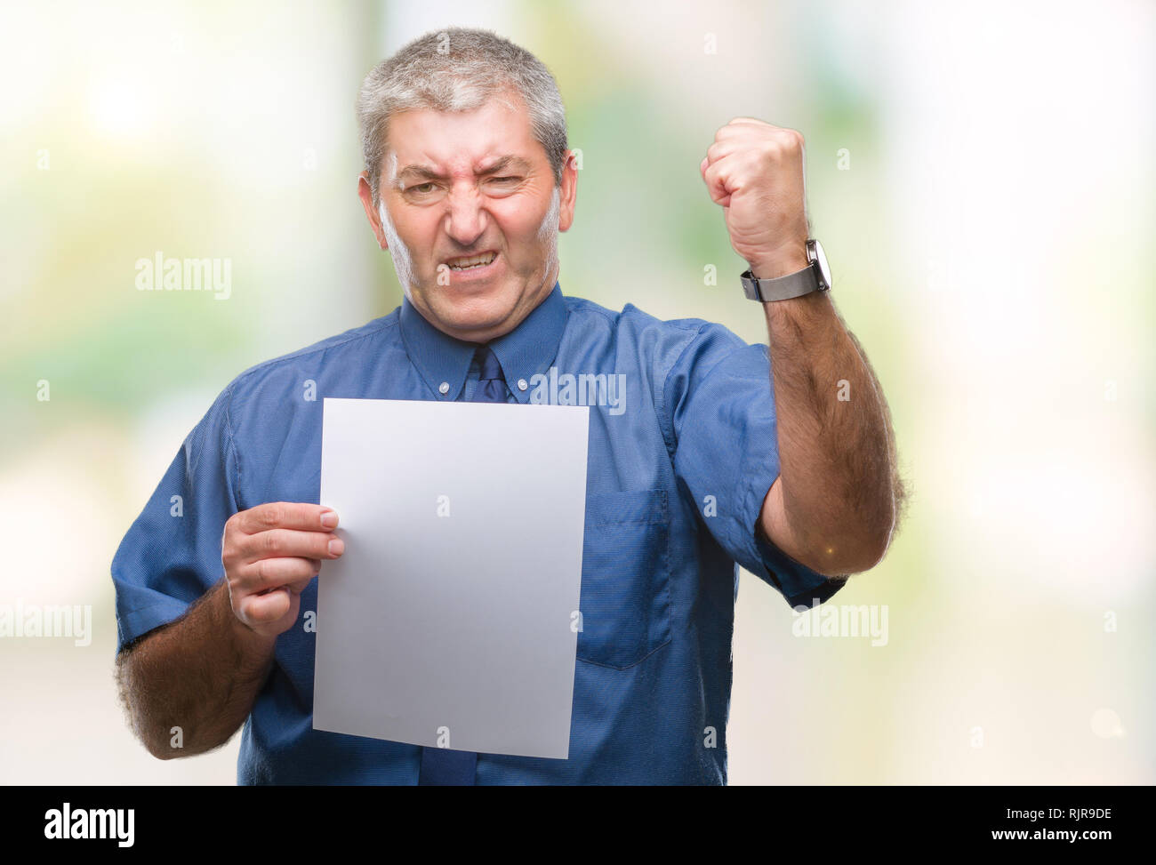 Handsome senior man holding blank sheet paper over isolated background ...