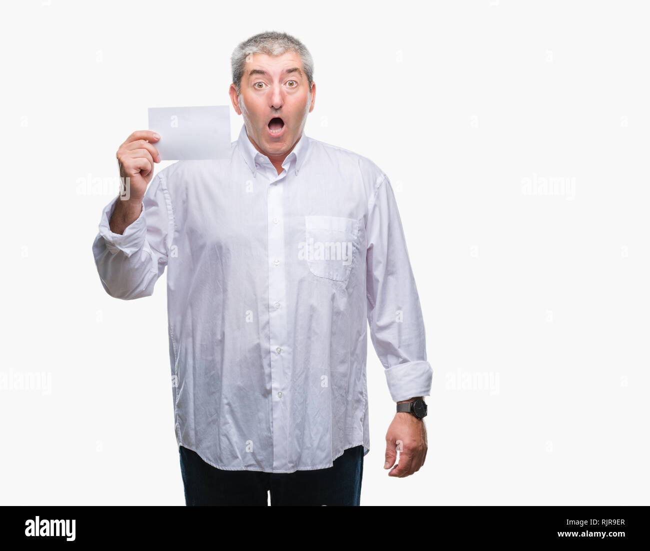 Handsome senior man holding blank card over isolated background scared ...
