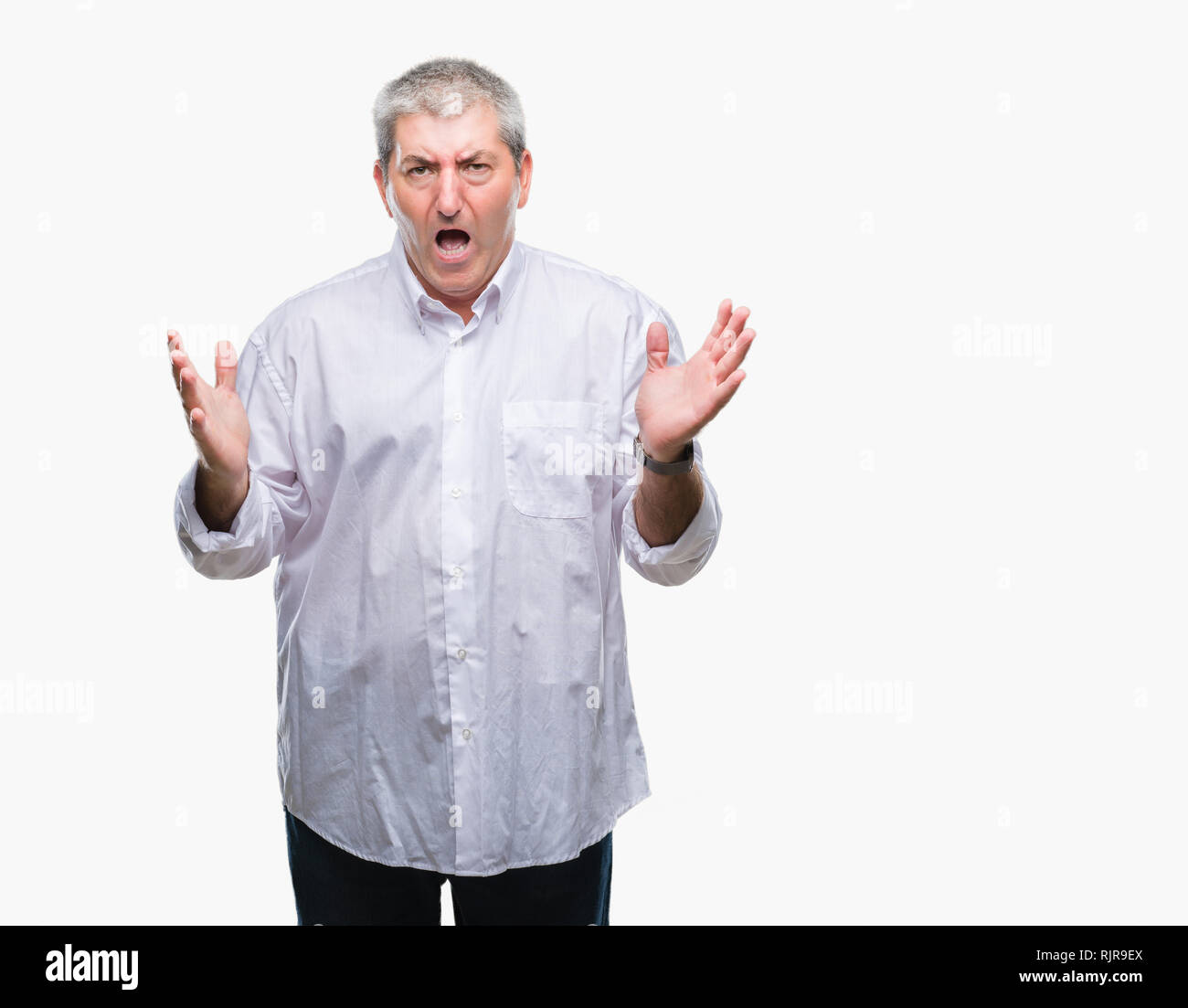 Handsome senior man over isolated background crazy and mad shouting and ...
