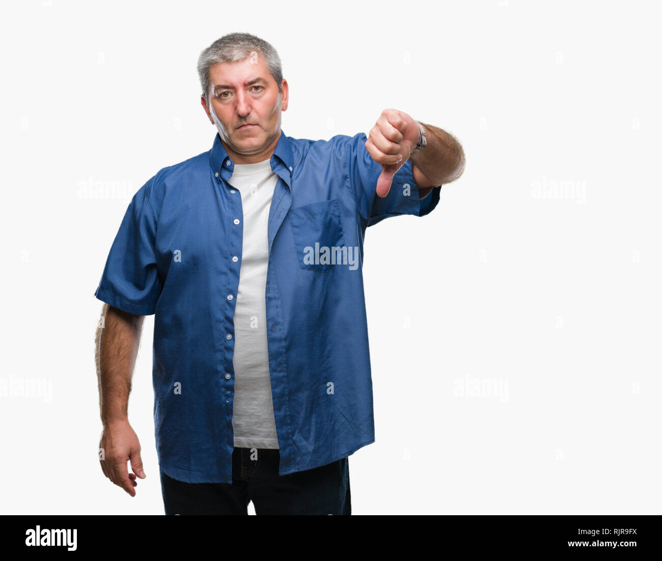 Handsome senior man over isolated background looking unhappy and angry ...