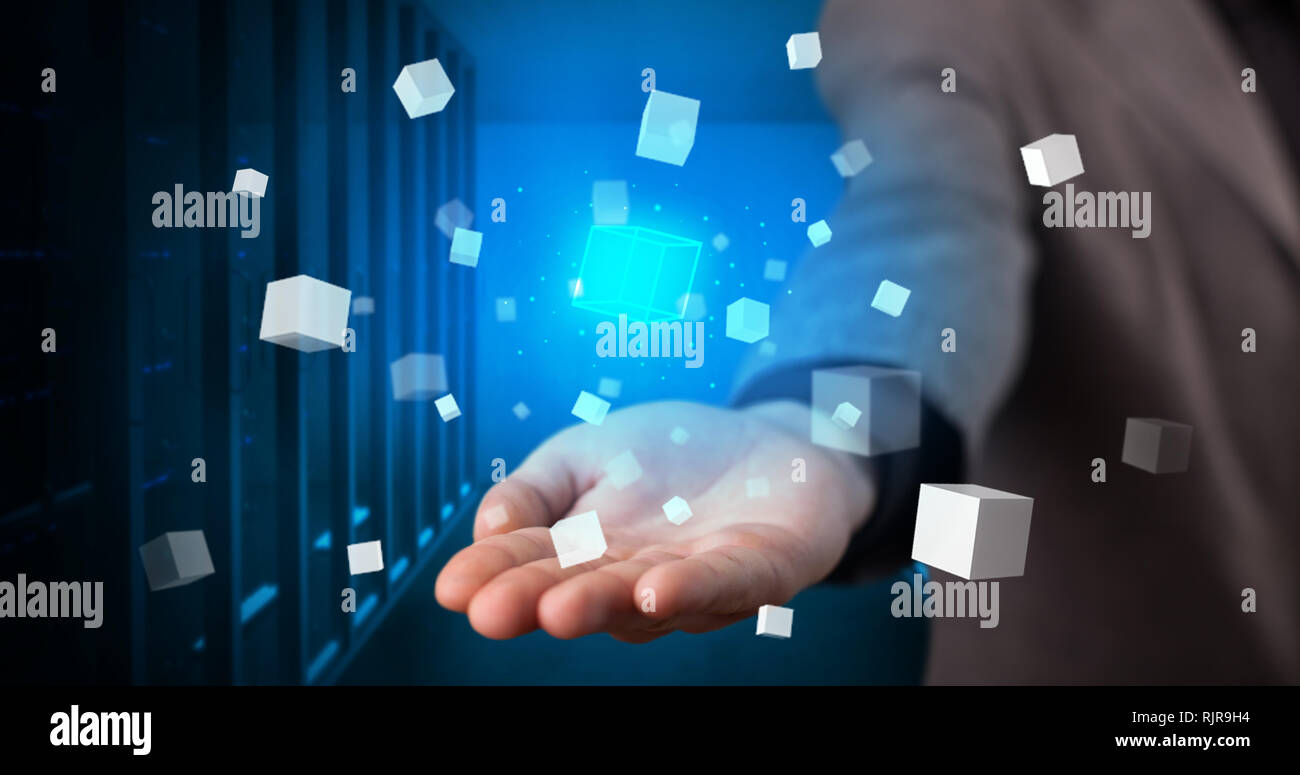 Person holding hologram projection displaying white cubes in server ...