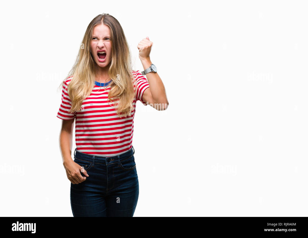 Young beautiful blonde woman over isolated background angry and mad ...