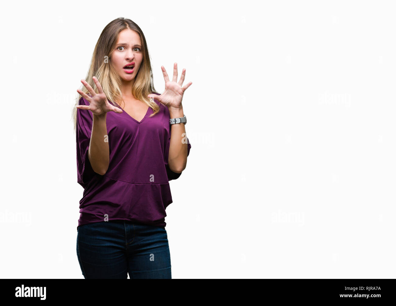 Young beautiful blonde elegant woman over isolated background afraid ...