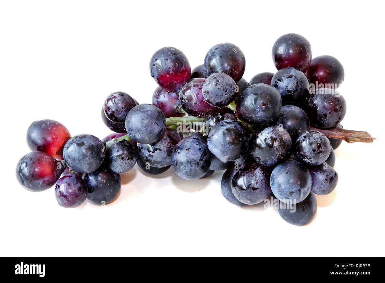 Fresh organic red grapes on white background Stock Photo - Alamy