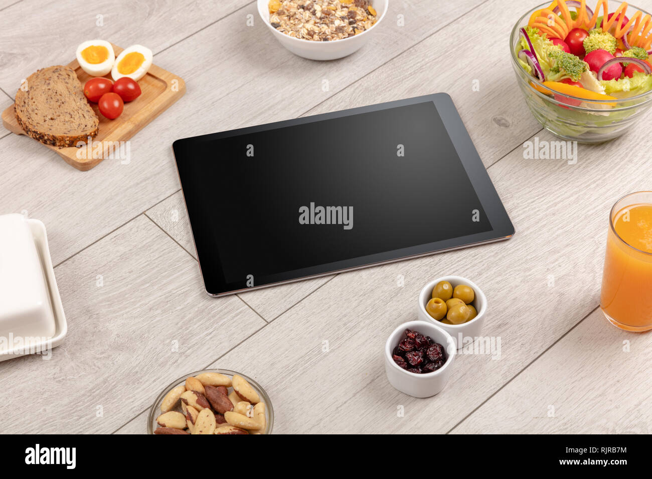 Healthy food composition with empty tablet Stock Photo - Alamy