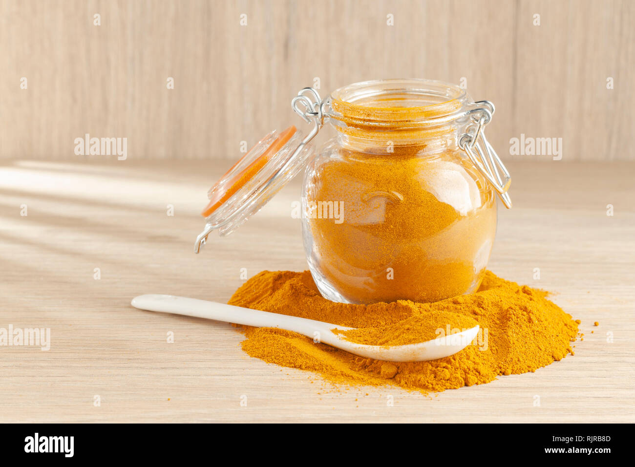 turmeric powder in glass bowl on wood- curcuma longa Stock Photo - Alamy