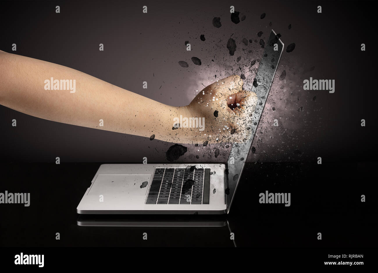 Strong male hand breaks laptop screen glasses Stock Photo - Alamy