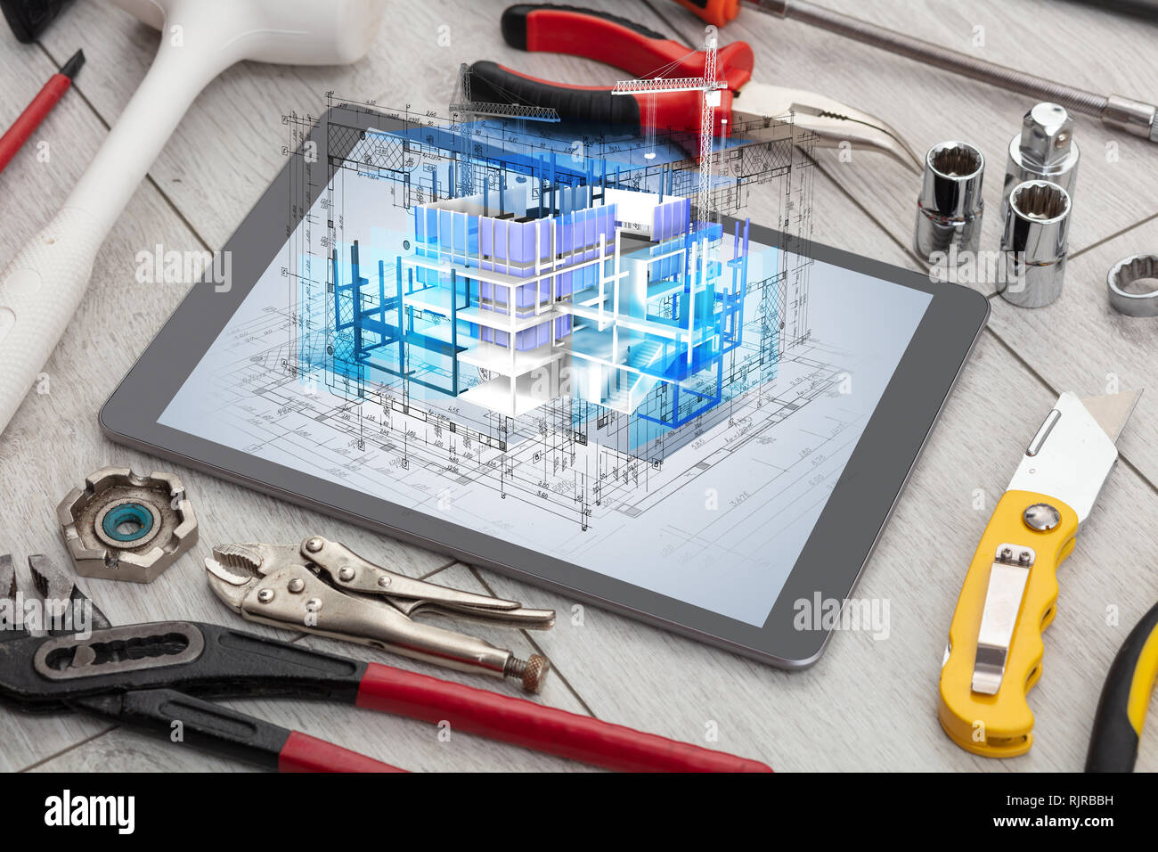 Tablet with construction tools and 3d house plan concept Stock Photo ...