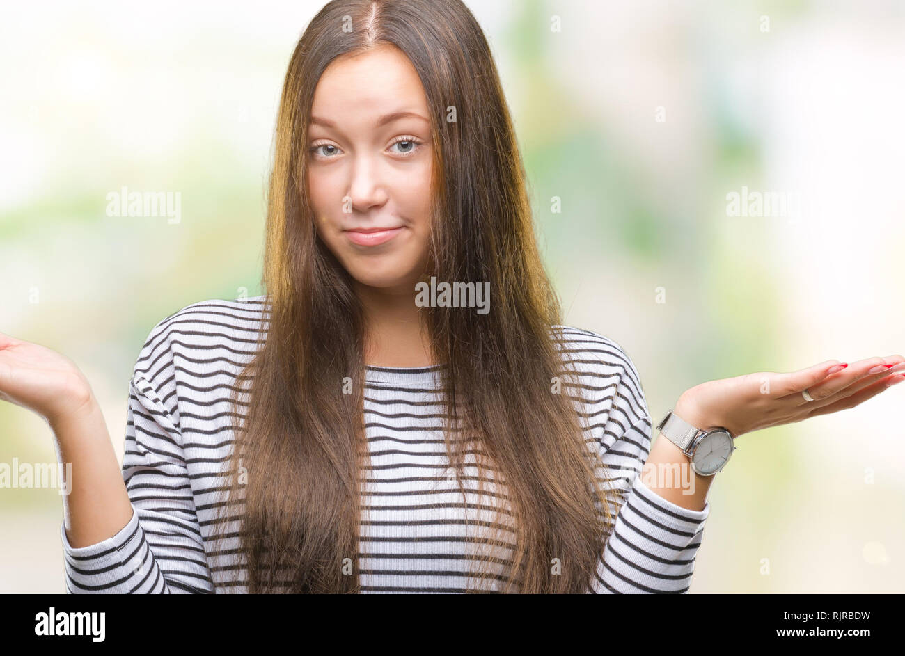 Young beautiful caucasian woman over isolated background clueless and ...