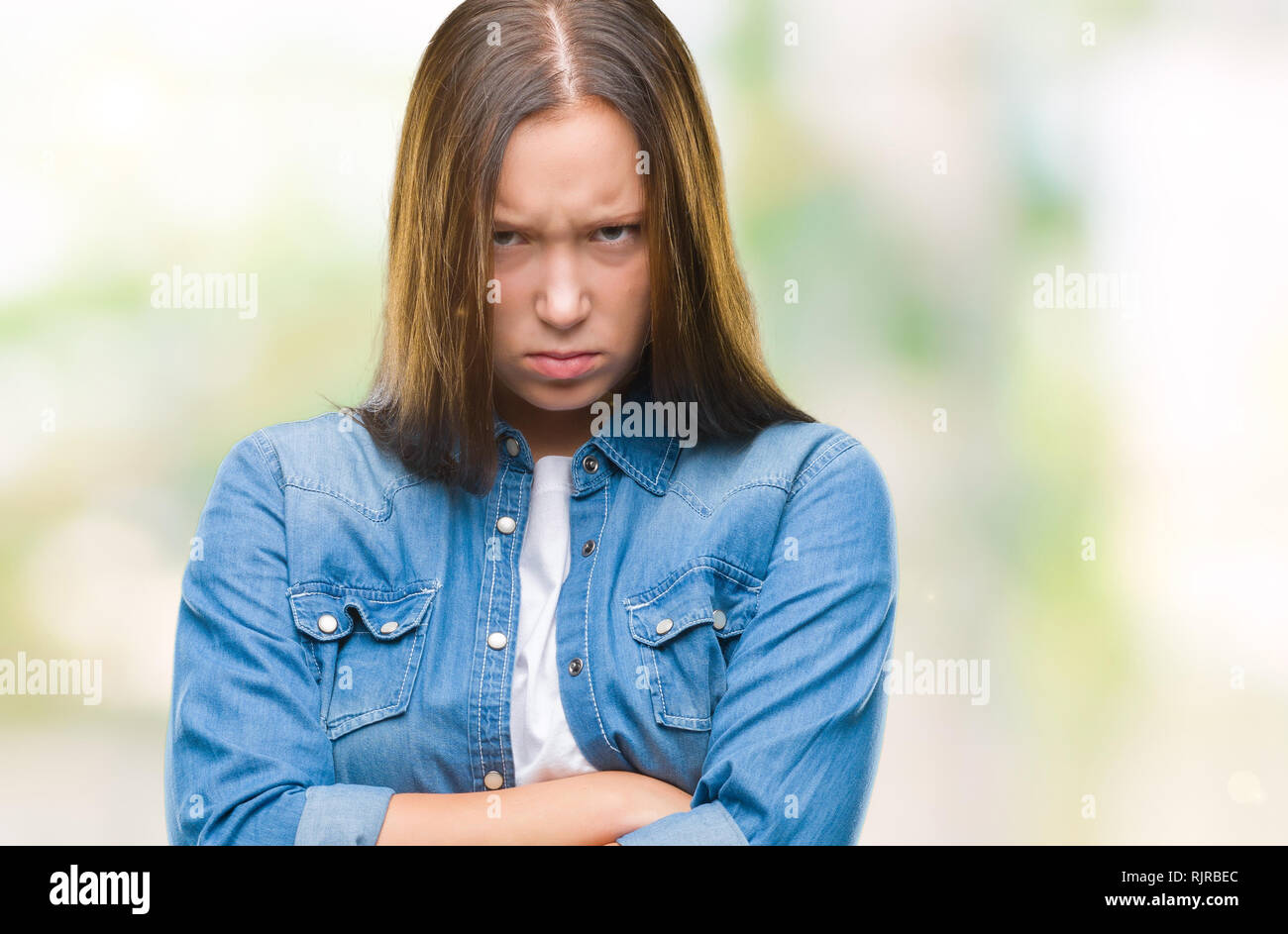 Young caucasian beautiful woman over isolated background skeptic and ...