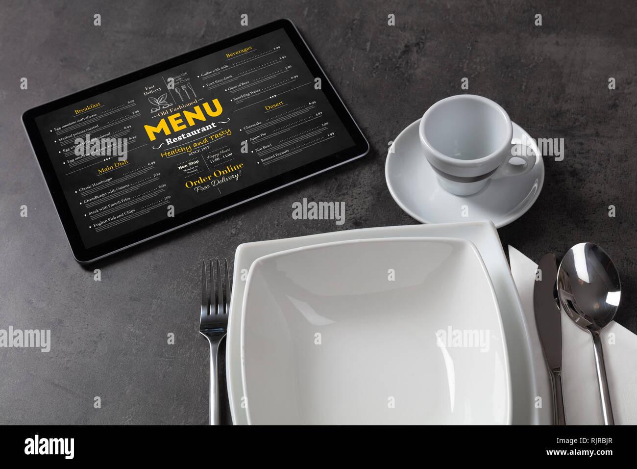 Empty plate and tableware with online order menu Stock Photo - Alamy