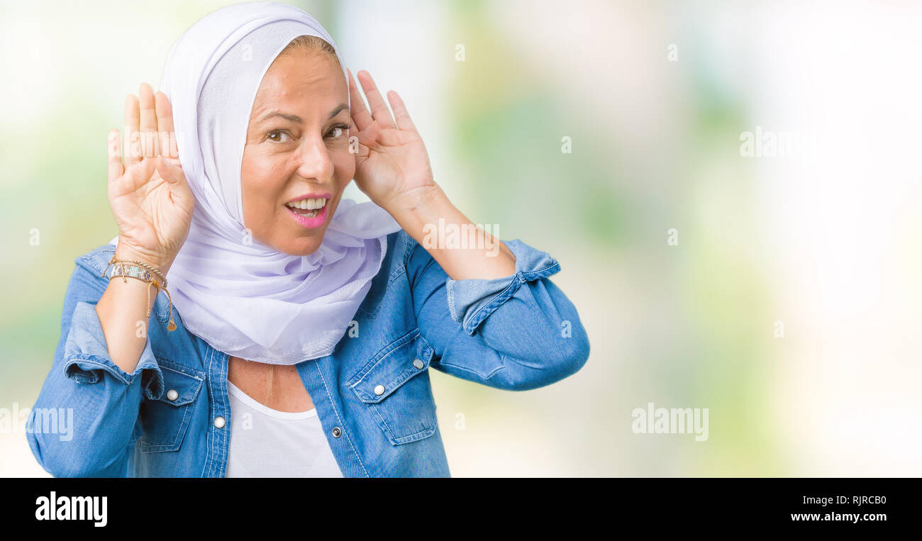 Middle age eastern arab woman wearing arabian hijab over isolated ...