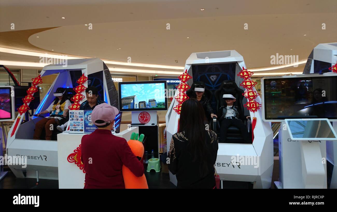 Shenzhen, China: people experience virtual reality toys Stock Photo - Alamy