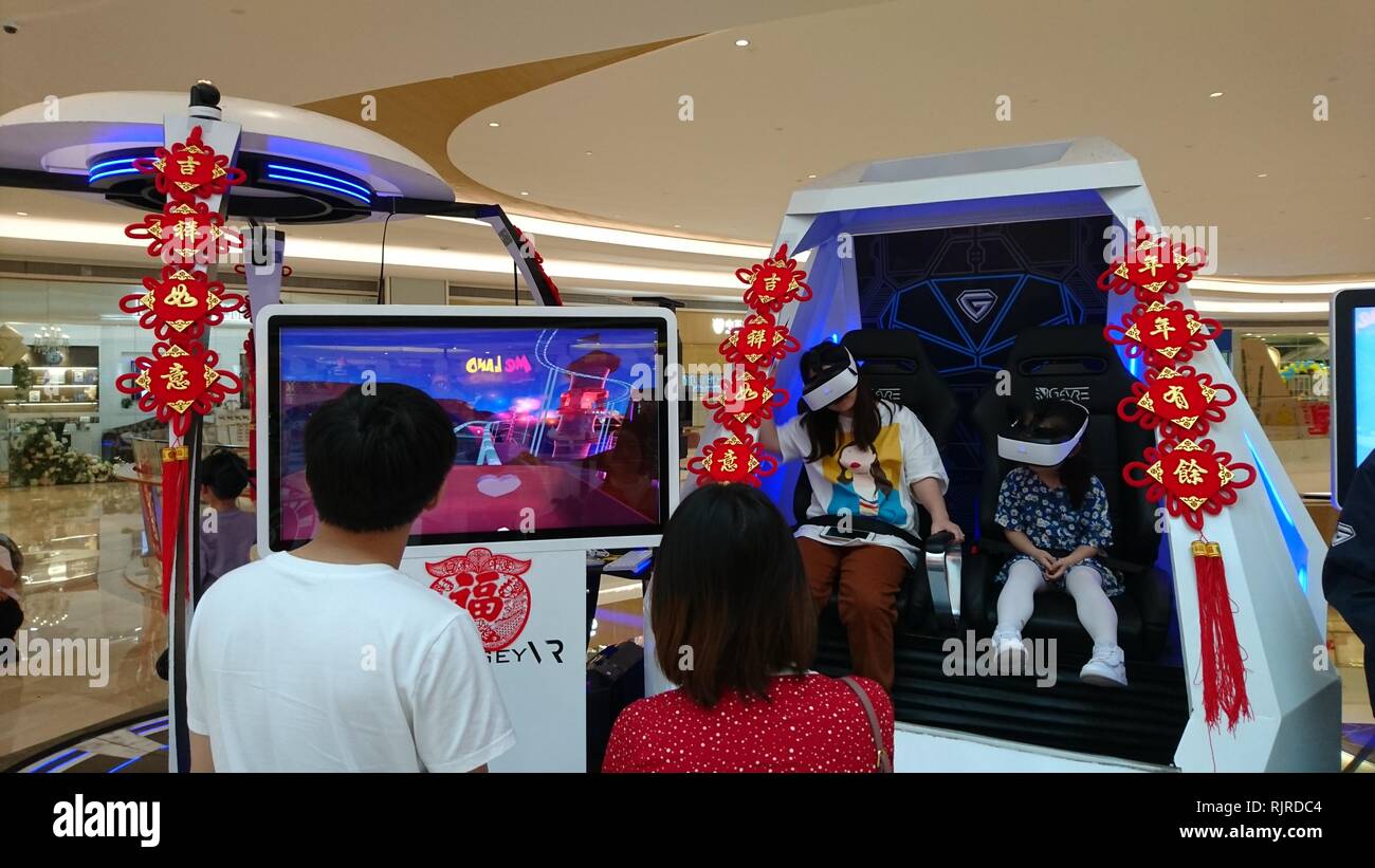 Shenzhen, China: people experience virtual reality toys Stock Photo - Alamy