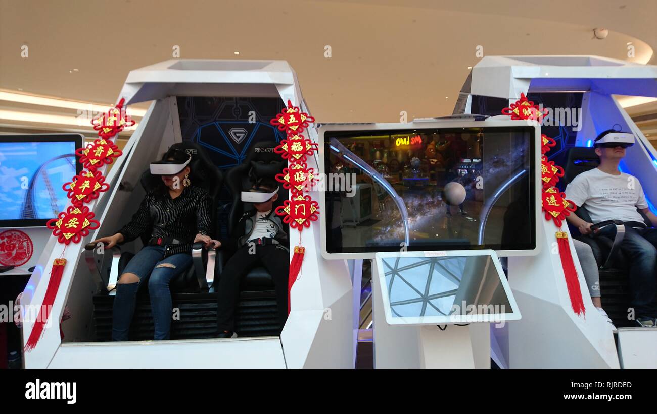 Shenzhen, China: people experience virtual reality toys Stock Photo - Alamy