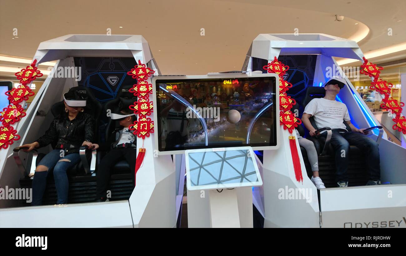 Shenzhen, China: people experience virtual reality toys Stock Photo - Alamy