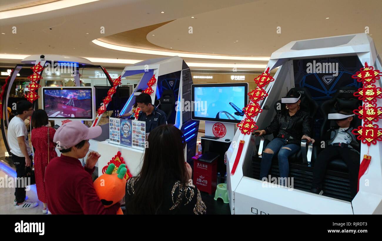 Shenzhen, China: people experience virtual reality toys Stock Photo - Alamy