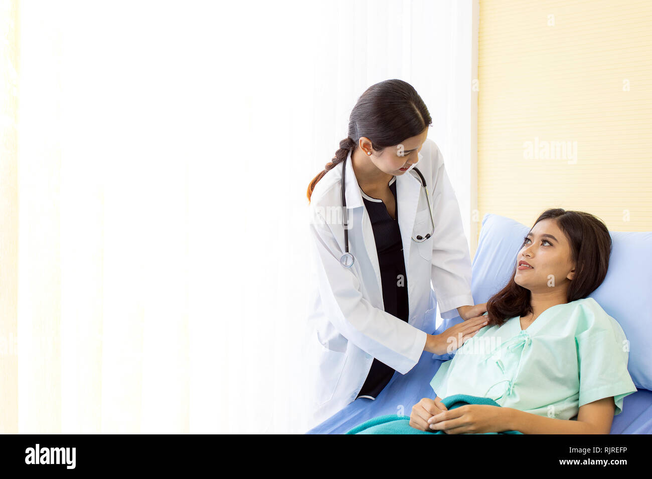 medical doctor touch on patient's sholder to cheer up patient Stock ...