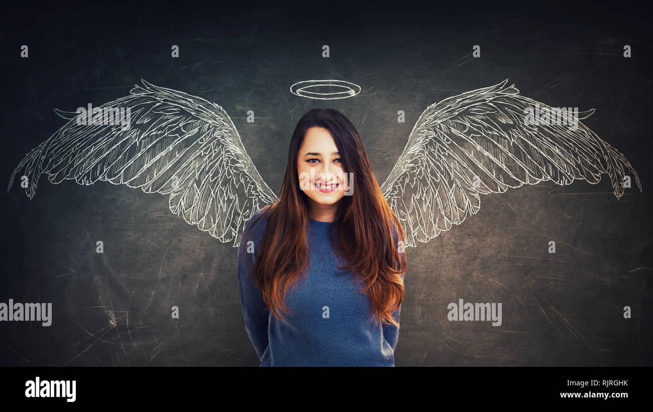 Joyful woman dreaming positive, imagining her as an angel with wings ...
