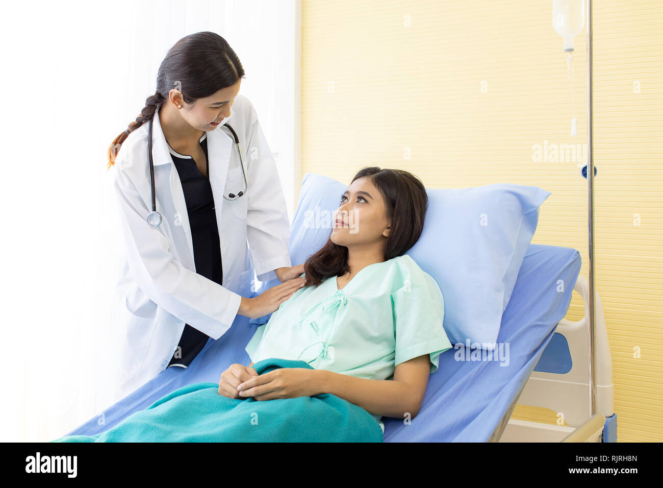 medical doctor touch on patient's sholder to cheer up patient Stock ...