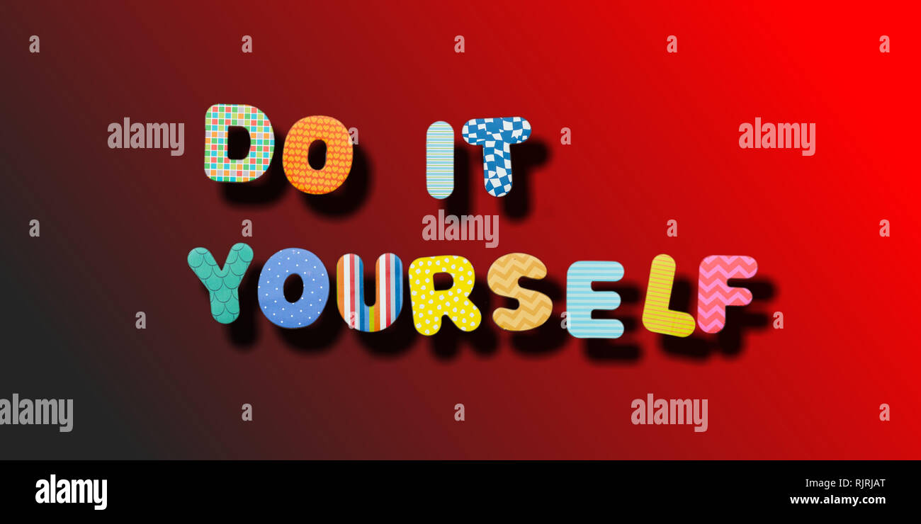 Do it yourself, diy concept. Text with colorful letters on red color ...
