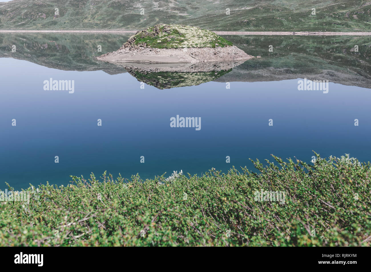 Island in Lake Tyin surrounded by Jutunheimen mountains, Norway, Europe ...