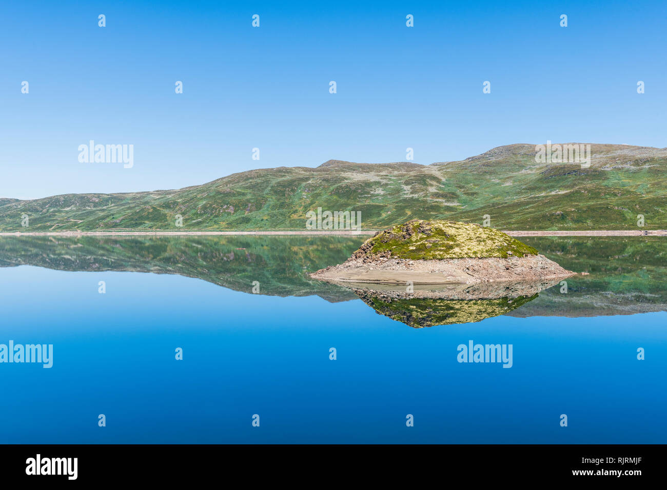 Island in Lake Tyin surrounded by Jutunheimen mountains, Norway, Europe ...