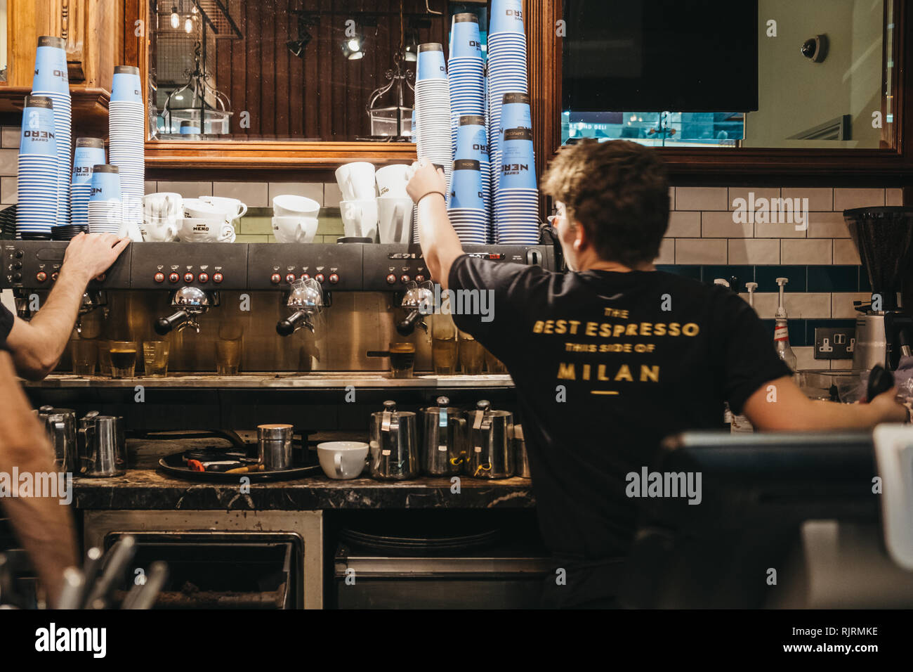 London, UK - January 26, 2019: Staff working behind the counter in Cafe ...