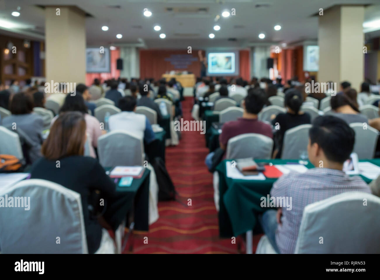 Abstract blurred photo of conference hall or seminar room which have ...