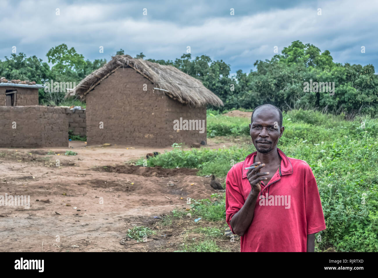 Malange / Angola - 12 08 2018: View of a friendly man with cigarette in ...
