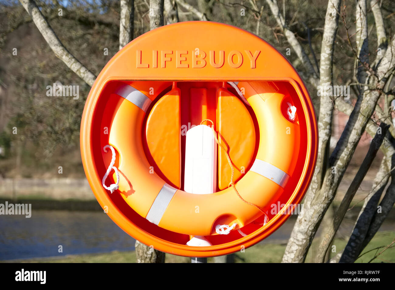 Life buoy orange ring water safety at boat mooring marina Stock Photo ...