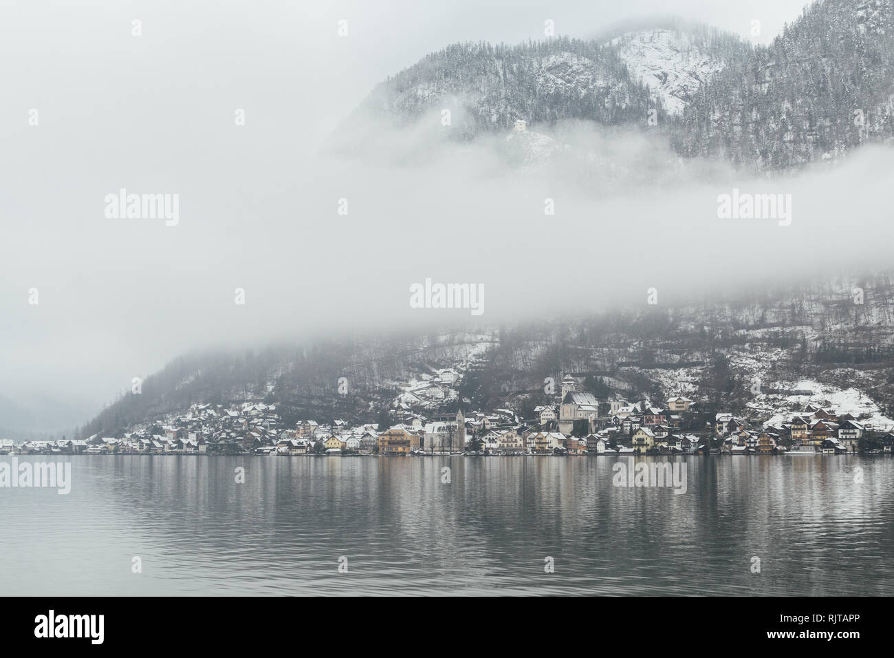 Alps mountains covered with snow and clouds in a cold winter day in ...