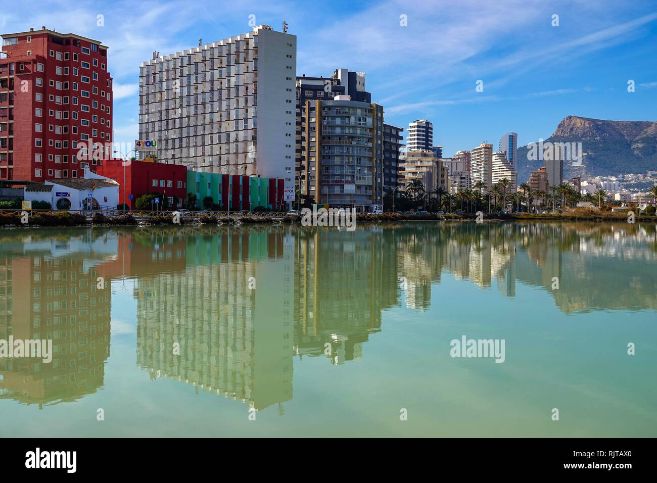 Salt-pan lagoon and tall buildings and reflections with surrounding ...