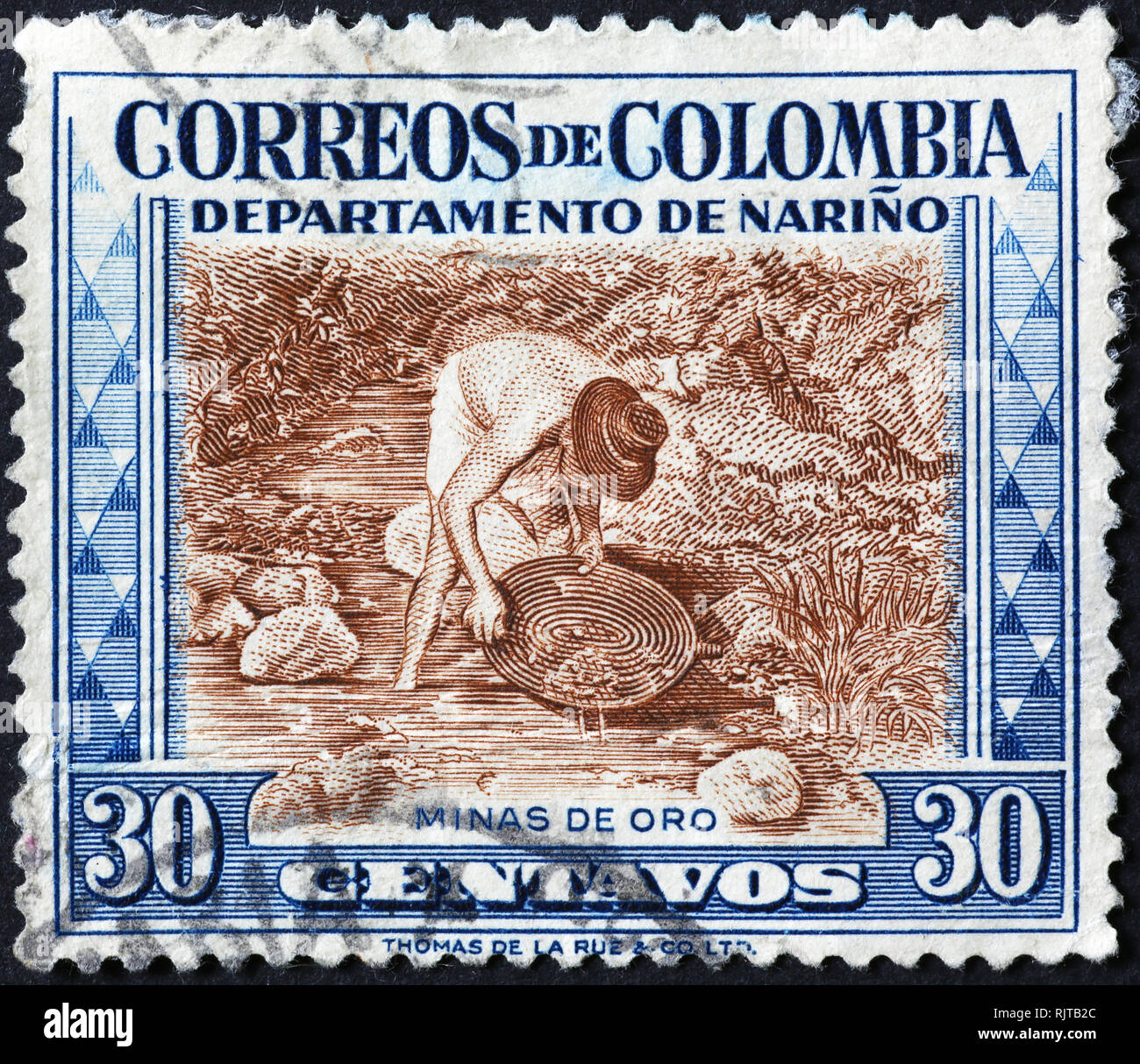 Gold miner on old colombian postage stamp Stock Photo - Alamy