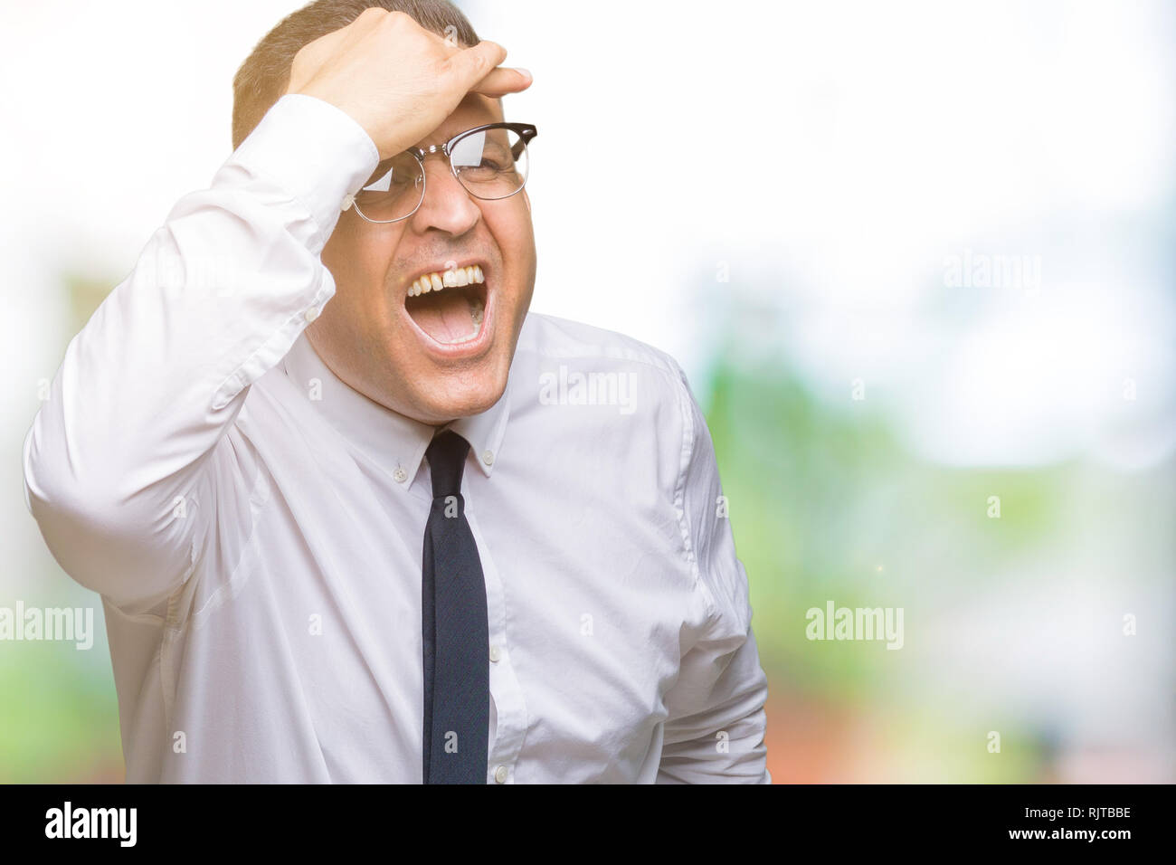 Middle age bussines arab man wearing glasses over isolated background ...