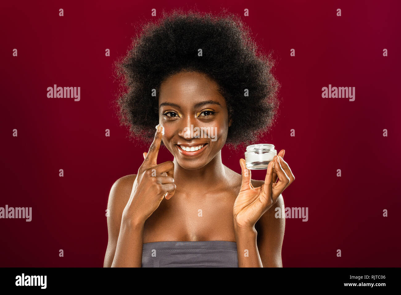 Positive young woman caring about her skin Stock Photo - Alamy