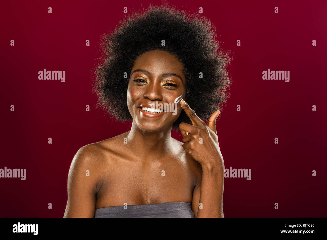 Positive young woman wanting to look perfect Stock Photo - Alamy