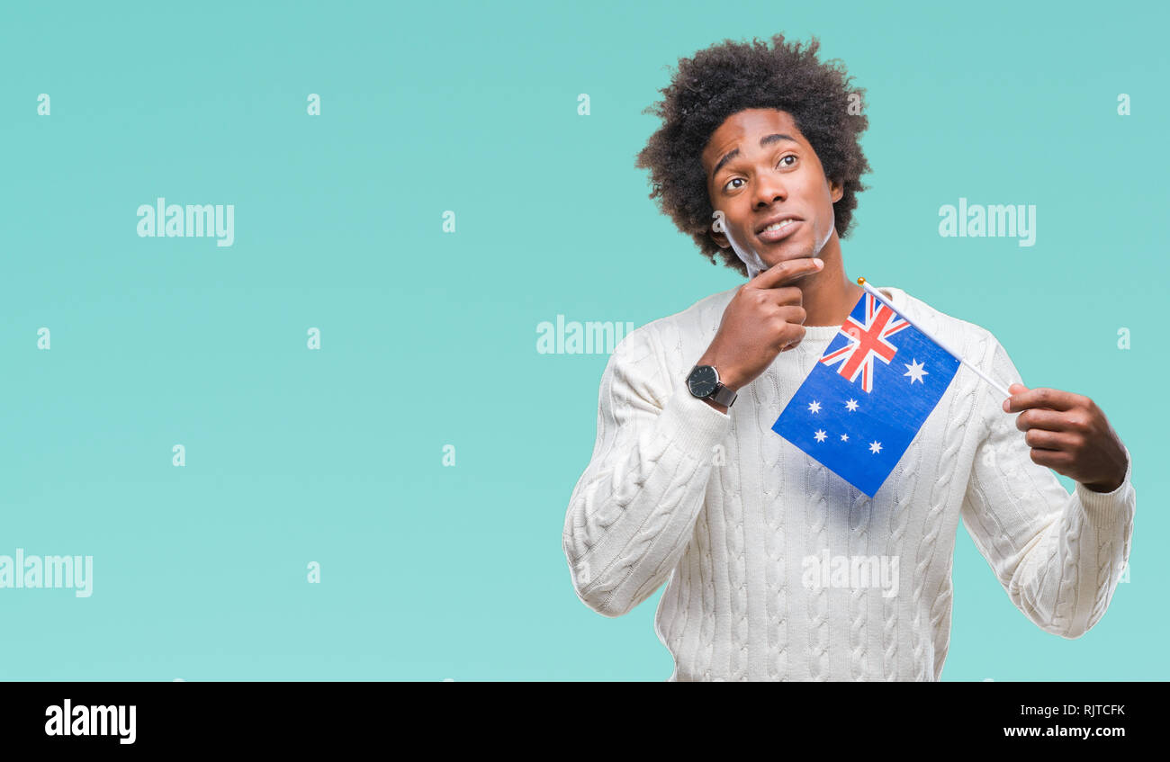 Afro american man flag of Australia over isolated background serious ...