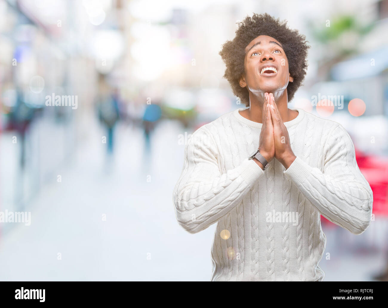 Afro american man over isolated background begging and praying with ...