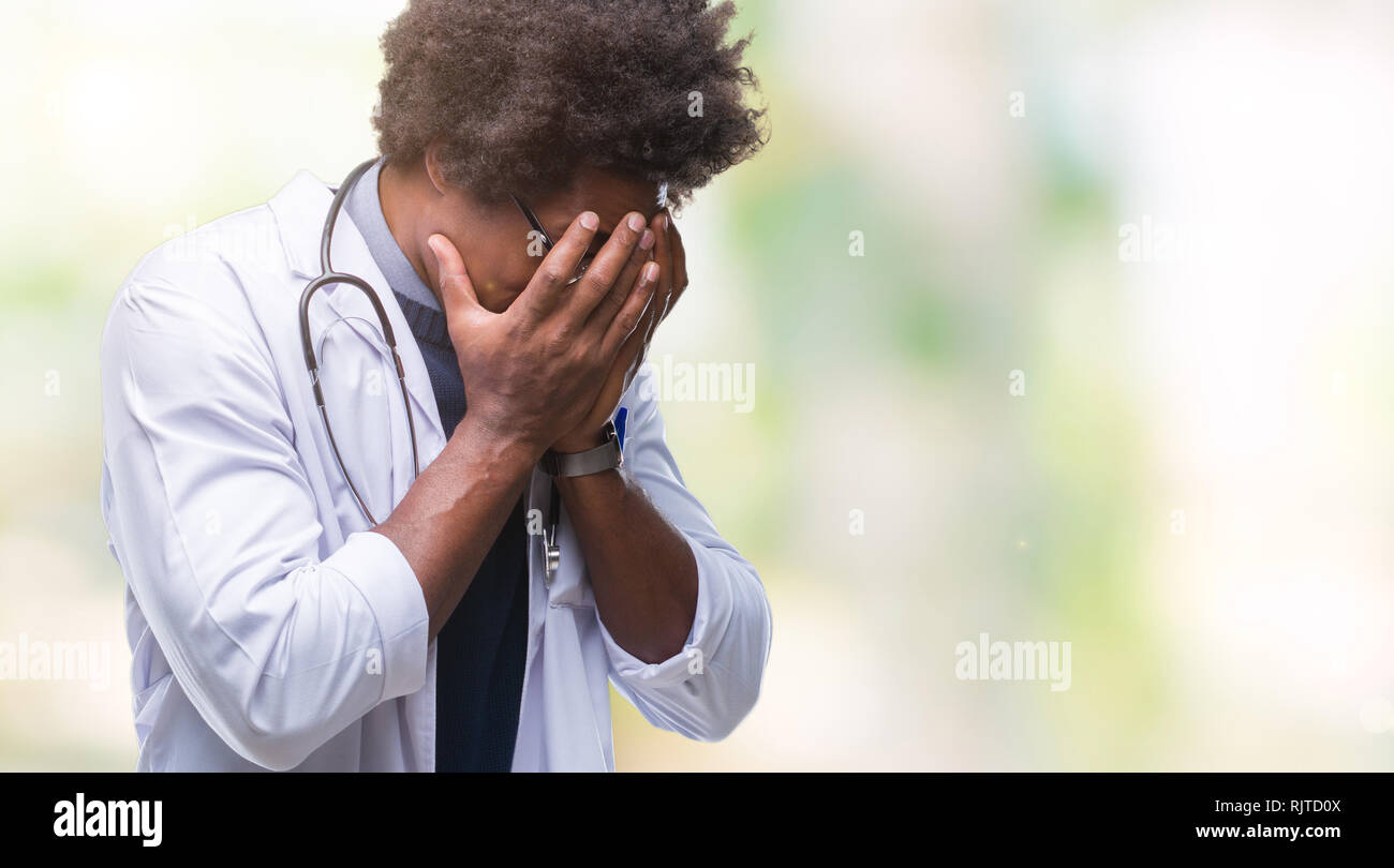 Afro american doctor man over isolated background with sad expression ...