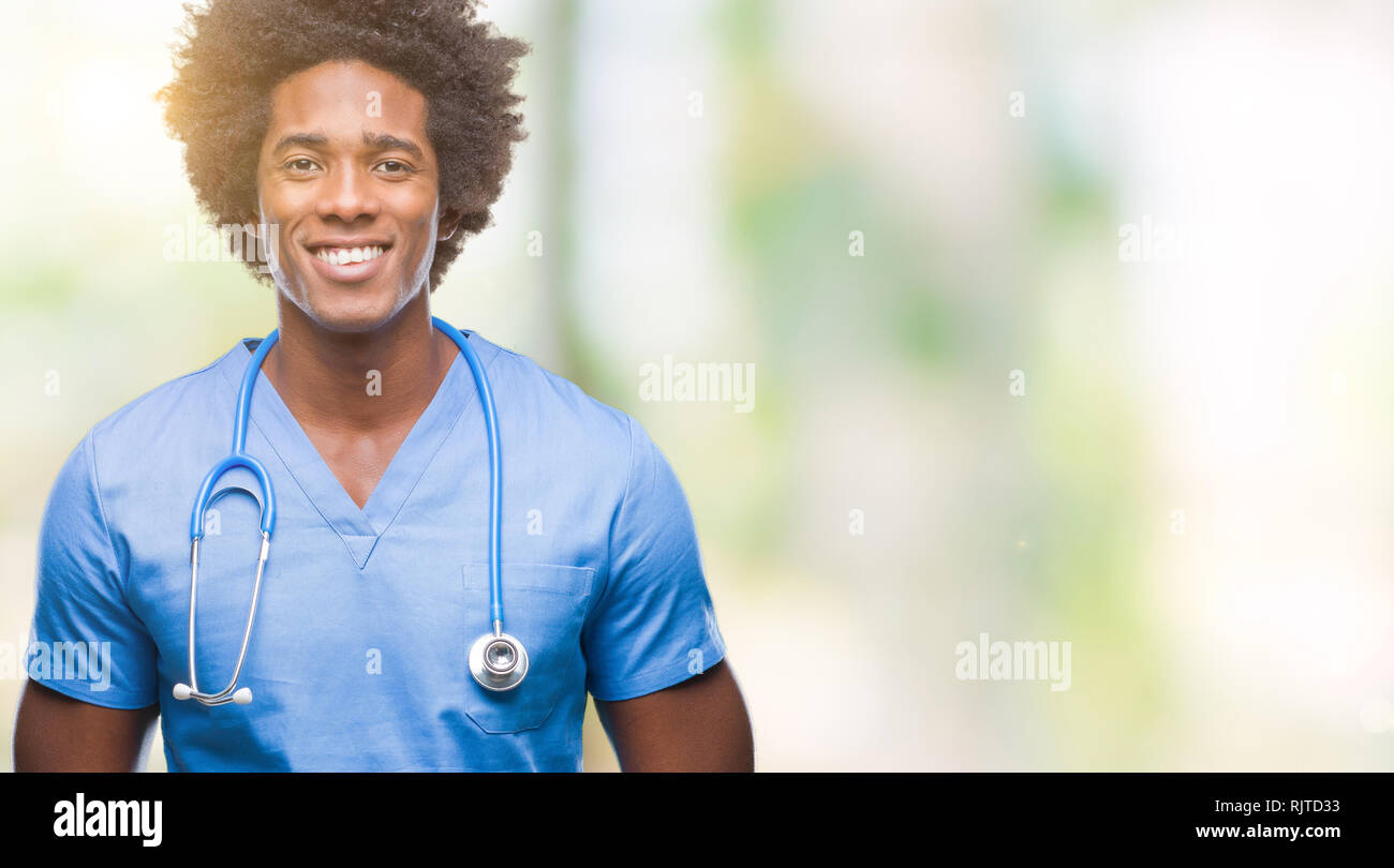 Afro american surgeon doctor man over isolated background with a happy ...