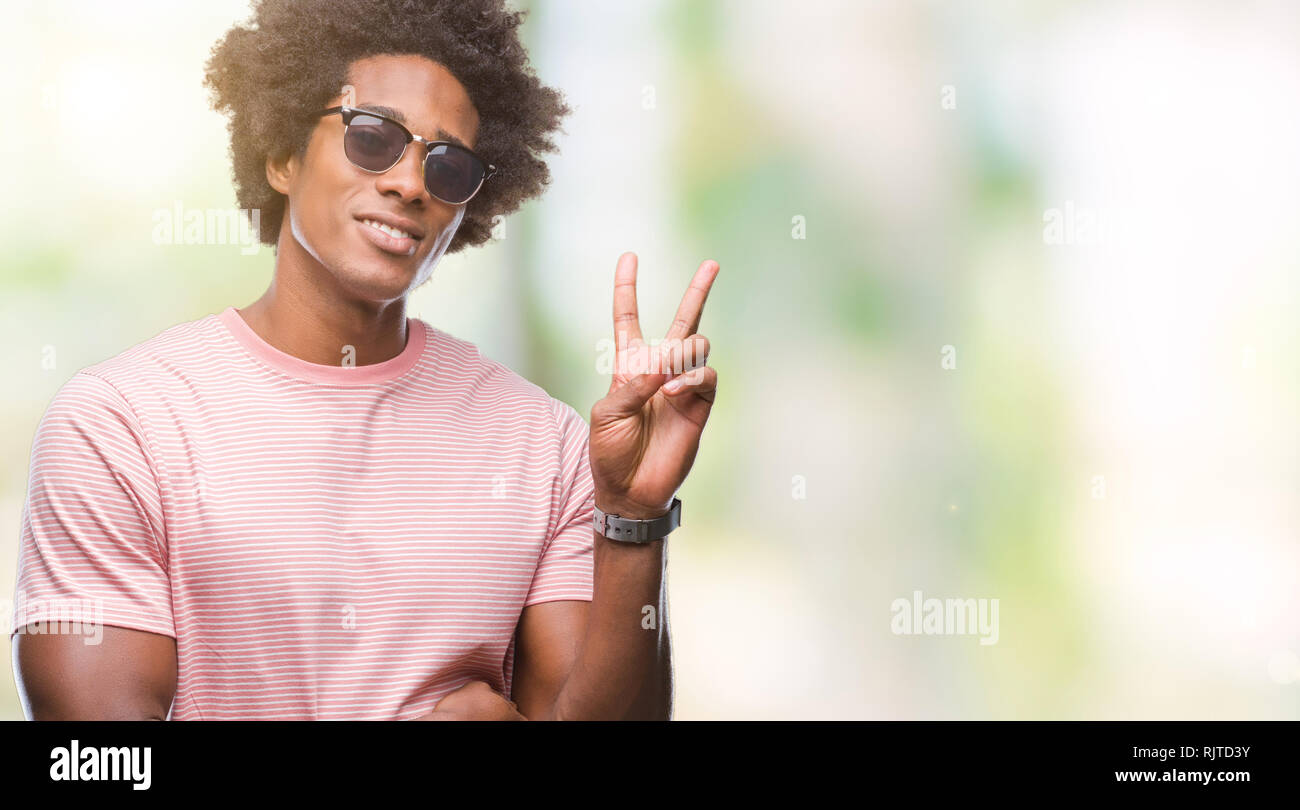 Afro american man wearing sunglasses over isolated background smiling ...