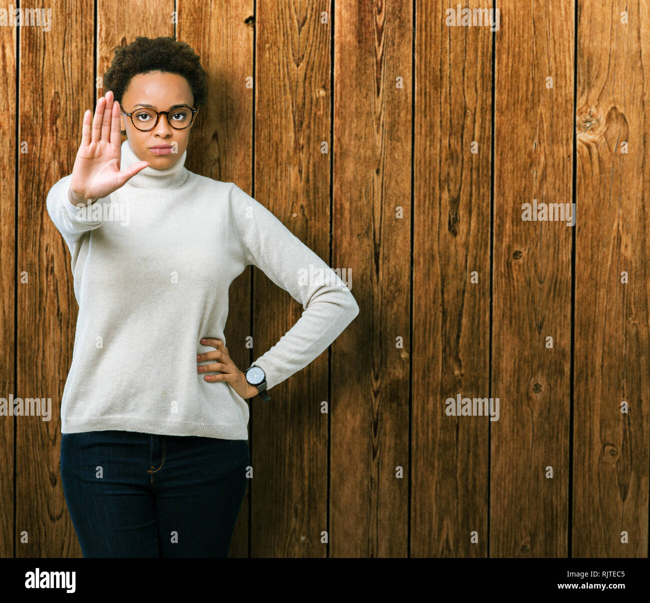 Young beautiful african american woman wearing glasses over isolated ...